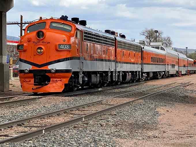 Engine 403 sits ready at the station, wearing that bold orange like it absolutely knows it's the star.
