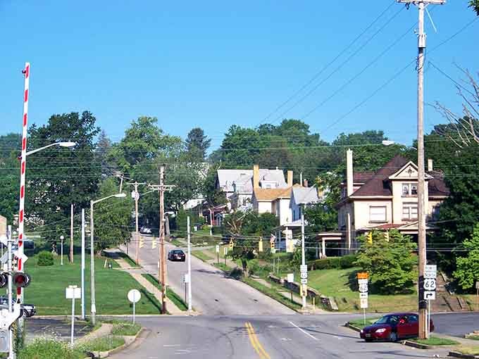Stately older homes line Sharon's sun-drenched street near the railroad crossing, the kind of neighborhood that still feels like home.
