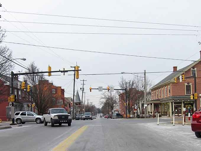 Wide streets and traffic lights mark the practical heart of town, where everyday life unfolds against a historic backdrop.