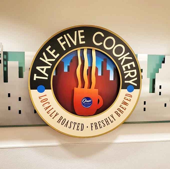 Bold retro logo with flame-licked graphics promises locally roasted coffee and freshly brewed flavors in Connecticut's capital city.