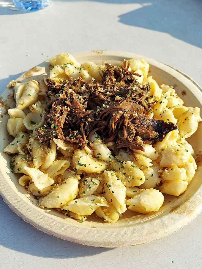 Creamy mac topped with tender shredded meat, a comfort food mashup so good it deserves its own standing ovation right now.