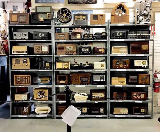 Shelf after shelf of vintage radios, each one a reminder that entertainment once required actual wooden furniture.