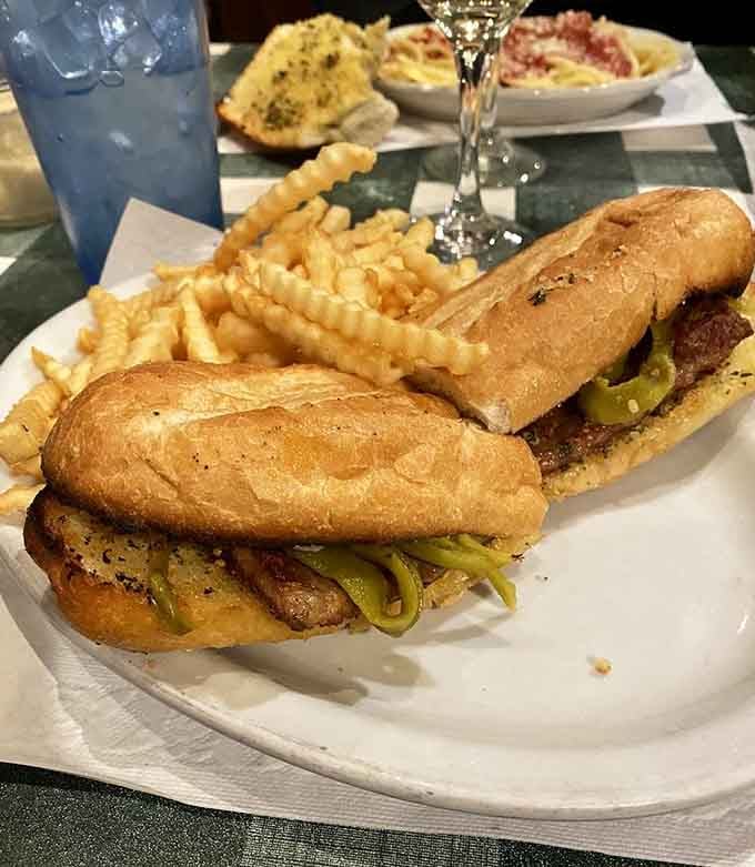A sausage and pepper sandwich with crinkle fries on the side. Tuesday nights just got a serious upgrade.