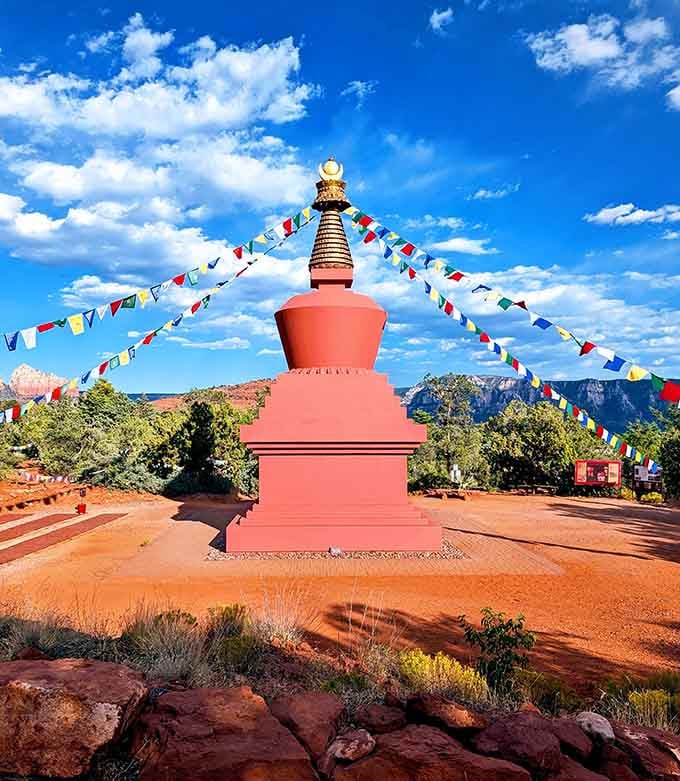 Prayer flags radiate from the stupa like colorful spokes, creating an unexpectedly joyful burst of color.
