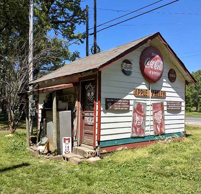 Old Coca-Cola signs and hand-painted faces make this little roadside building the most interesting structure on the block.