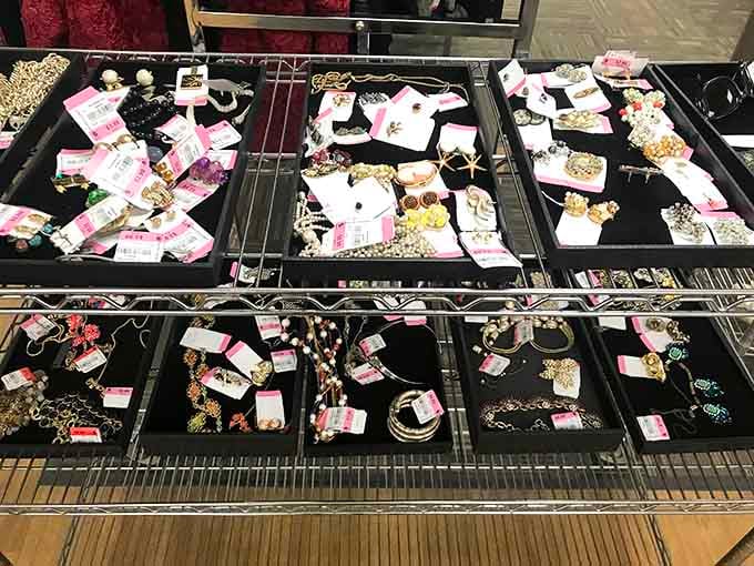 Vintage brooches, necklaces, and earrings laid out like a jewelry store, minus the intimidating salesperson hovering nearby.