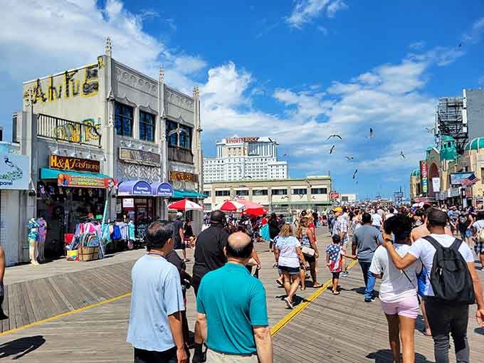 Summer crowds fill the boardwalk with energy, color, and the universal language of people having a genuinely good time.