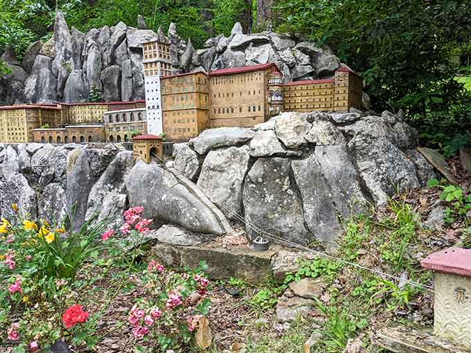 Perched dramatically on real rock formations, this miniature complex looks like it belongs in an adventure film.