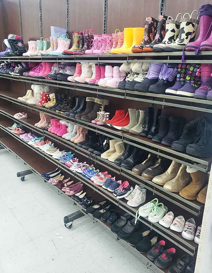Row after colorful row of kids' shoes, boots, and rain gear. Growing feet have never had it this good.