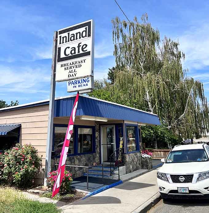 Inland Cafe's classic roadside sign beckons hungry travelers with the promise of all-day breakfast and strong coffee that actually works.