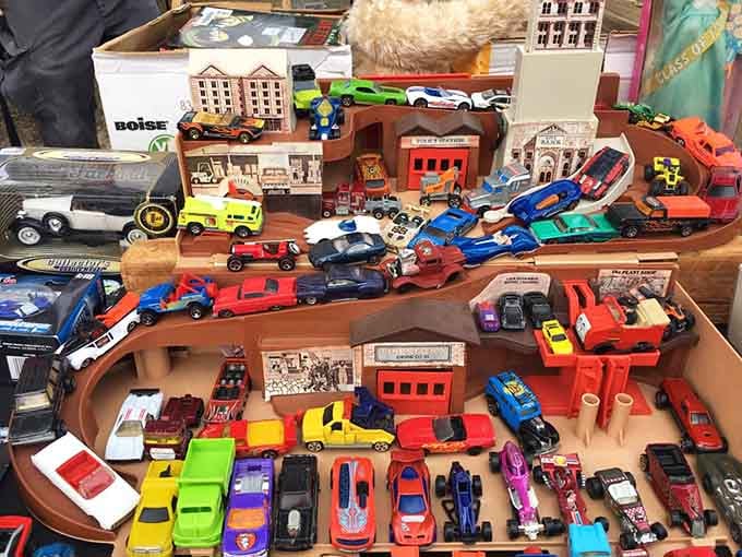 Rows of die-cast cars lined up like rush hour on a very colorful, very tiny highway.