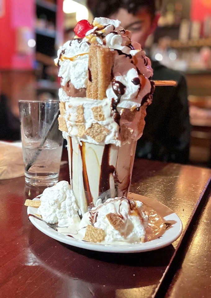 Churros, caramel, whipped cream, and a cherry on top because apparently subtlety was never on the menu.