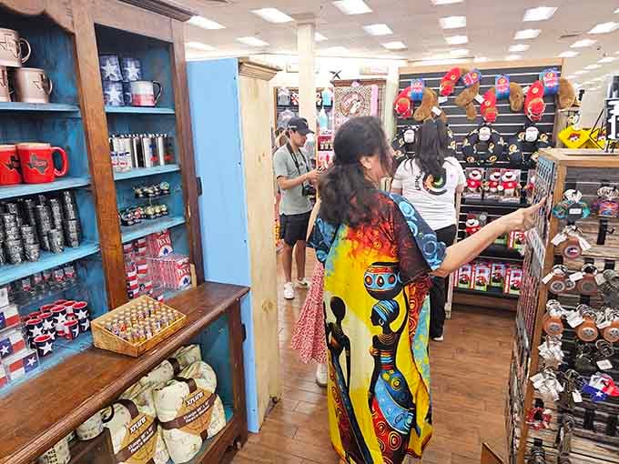Shoppers browse Texas-themed mugs, gifts, and souvenirs with the focused energy of seasoned treasure hunters.