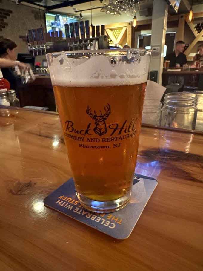 A cold, golden house-brewed pint sitting at the bar — some things in life are simply, perfectly right.
