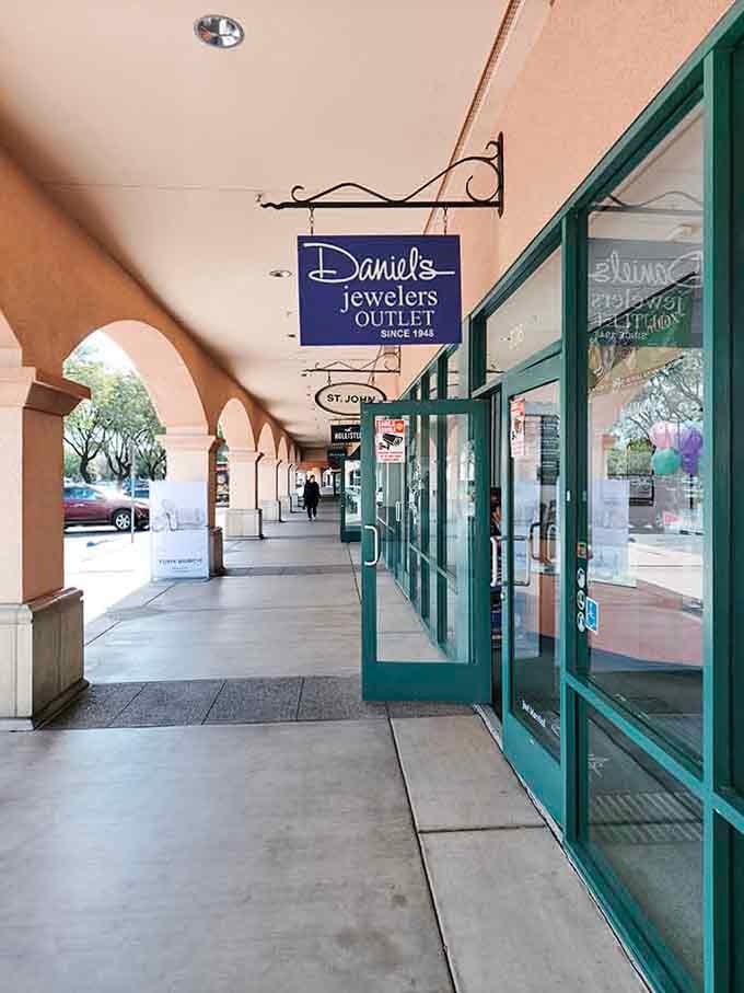 Daniel's Jewelers Outlet tucked under those arched walkways, proof that good things really do come in unexpected packages.