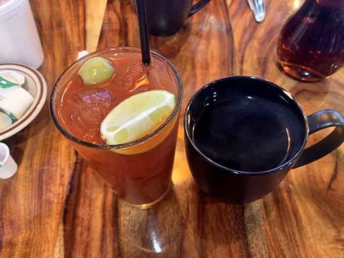 Iced tea with lime and a steaming black coffee mug. The classic breakfast duo that never lets anyone down.