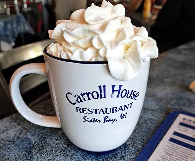 Hot chocolate piled high with whipped cream in a signature mug makes you feel like a kid again.