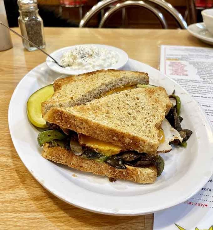 Grilled peppers, onions, mushrooms, and a fried egg stacked on toasted bread, even the vegetable sandwich means serious business here.