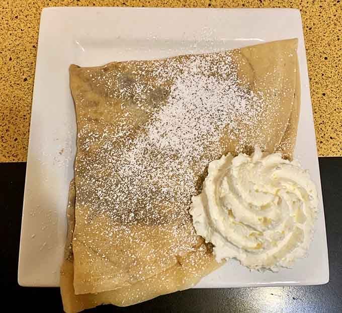 Dusted with powdered sugar and served with a generous swirl of whipped cream &mdash; the Paris cr&ecirc;pe keeps things beautifully simple.