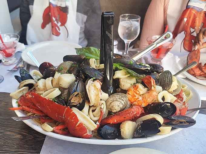 Seafood pasta piled high with mussels, clams, calamari, and lobster. This dish doesn't whisper, it announces itself.