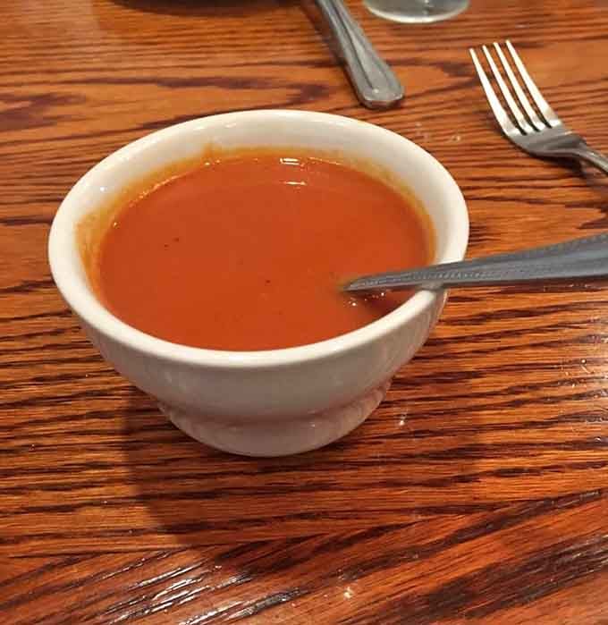 That rich, deep red color tells you everything. One spoonful of this tomato soup and the whole world slows down.