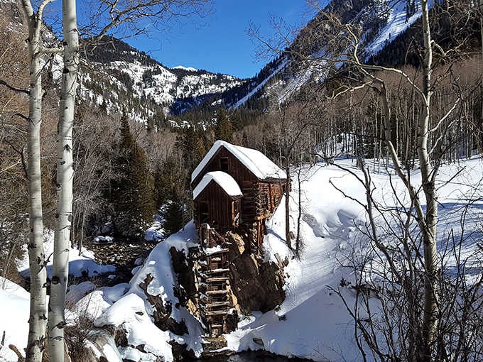 Winter transforms the mill into a snow-dusted fairy tale that requires serious skills to reach safely.
