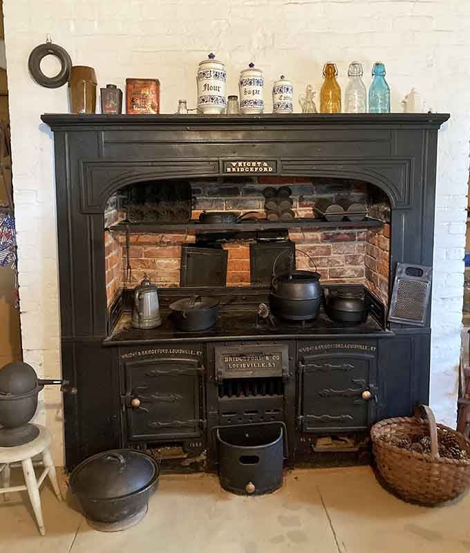 This massive wood-burning cooking range once fed an entire household, and it still commands the room like a boss.