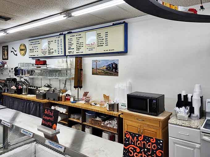Salted Caramel Brownie on the chalkboard, a train photo on the wall &mdash; this counter has personality packed into every inch.