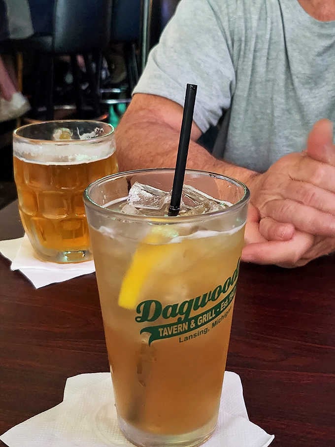 A branded Dagwood's glass filled with something cold and a cold beer waiting patiently behind it. The perfect tavern pairing.