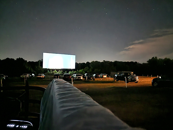 Stars above, movie screen glowing, cars lined up in the dark. This is what a perfect night looks like.