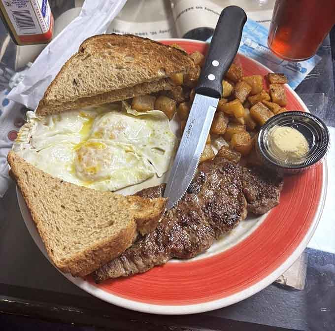 Steak, eggs, toast, and home fries on one plate. This breakfast means you won't need to eat again until tomorrow, maybe.