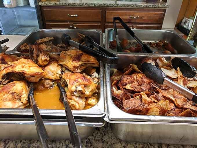 Whole smoked chickens and homemade chips sitting in the steam table, ready and waiting to make your day better.