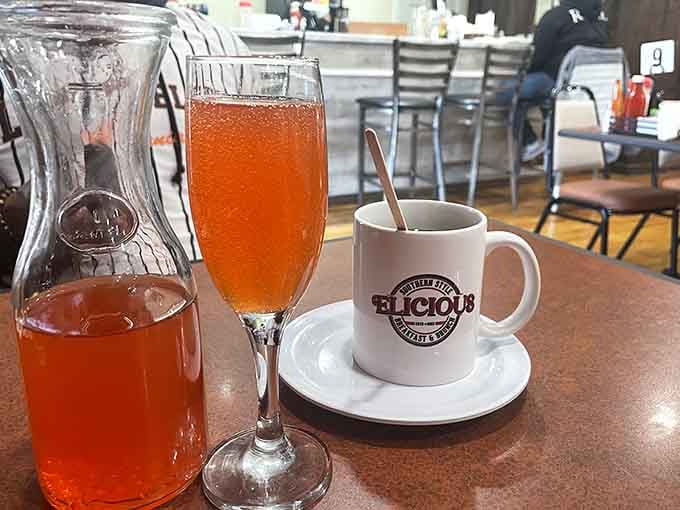 A mimosa, a carafe, and an Elicious coffee mug, the holy trinity of a perfect brunch morning.