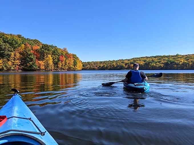 Paddling through fall foliage on Splitrock Reservoir is the kind of experience that makes you question every vacation you've ever booked.