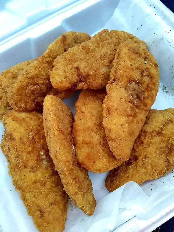 A full box of golden chicken tenders so perfectly fried, even the most devoted pescatarian might reconsider their choices.