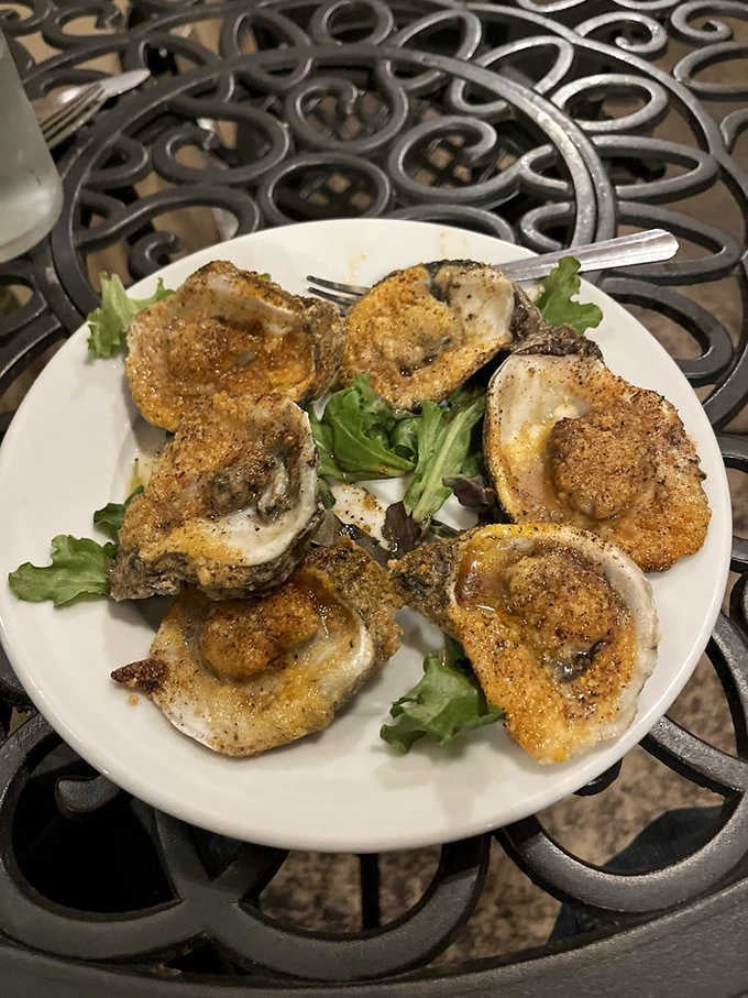Charbroiled oysters get the Rockefeller treatment, dressed up fancy but still down to earth and ready to party.