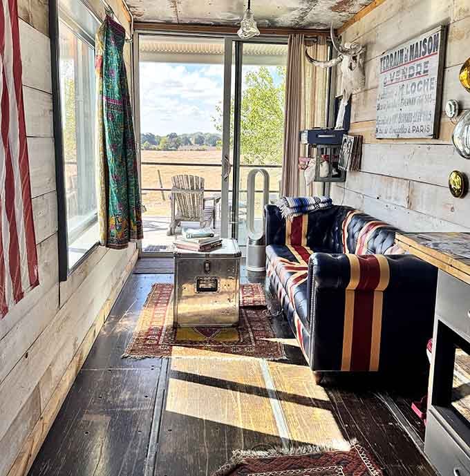A Union Jack Chesterfield sofa, layered rugs, and a view straight out to the Texas countryside. This living room means serious business.