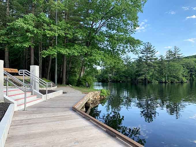 Dunn Pond's glassy water and wooden boardwalk offer the kind of stillness that city life simply cannot manufacture.
