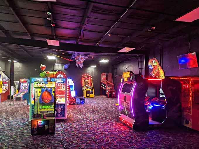 The arcade glows like a neon fever dream, and every machine is quietly judging your high score.