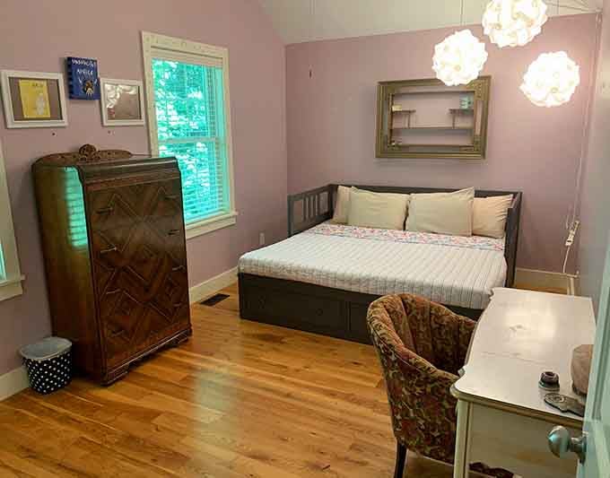 Soft lavender walls and vintage furniture. This room has more personality than most people do.