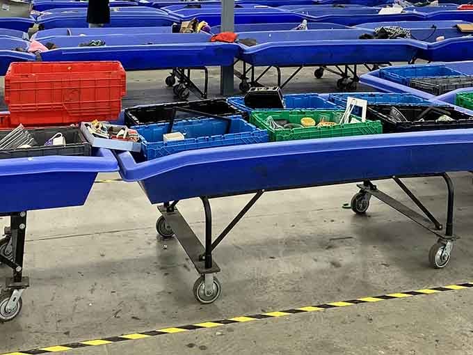 Row after row of blue bins stretch into the distance, each one a mystery box you actually want to open.