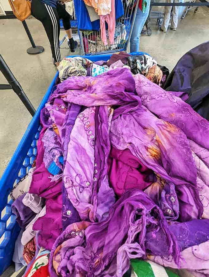 A whole bin of vibrant purple scarves, because sometimes the bins just decide to be fabulous.