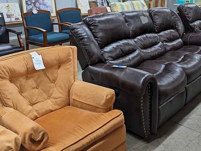 Sofas and armchairs sitting side by side like old neighbors, each one solid, comfortable, and priced far below anything at a furniture store.