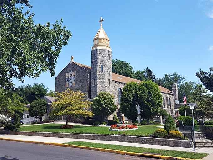 Christ the King Catholic Church stands with quiet dignity, its stone facade a permanent fixture of the community.