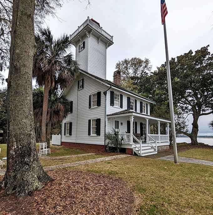 An American flag, a front porch, and a lighthouse tower. This exterior is doing a lot of heavy lifting, beautifully.