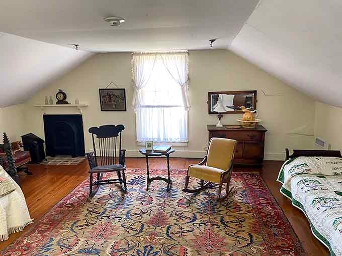 The sloped attic room is cozy and unhurried, a quiet corner where history settles in comfortably.