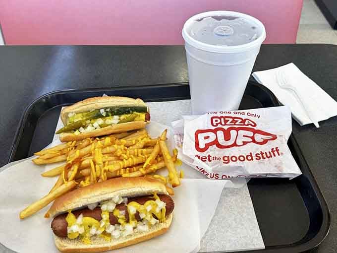 Two Chicago dogs, a pizza puff, and a cold drink on one tray, the Holy Trinity of an Illinois afternoon done right.