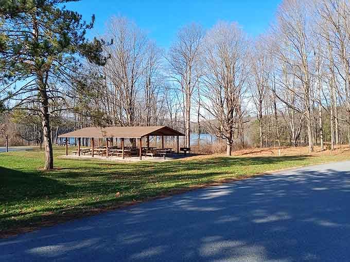 A lakeside pavilion built for the kind of picnic that turns into a three-hour afternoon.