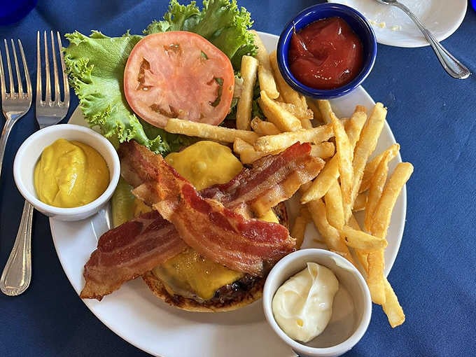 A bacon cheeseburger with fries and all the fixings, because even historic hotels know comfort food never goes out of style.