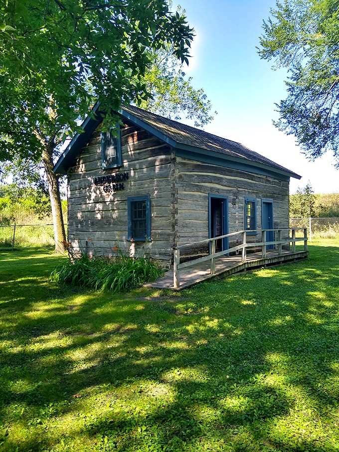 Rough-hewn logs, blue trim, and a story older than anything on your street. The Anderson Cabin delivers.